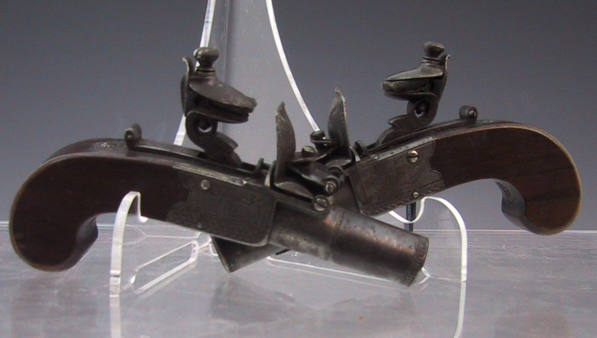 A pair of early 19th century flintlock box lock turn-off pocket pistols ...