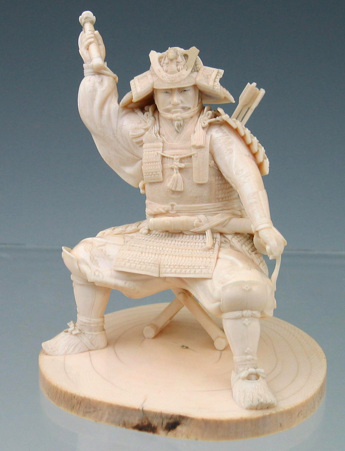 A Japanese carved ivory figure of a Samurai warrior, | 10 December 2004