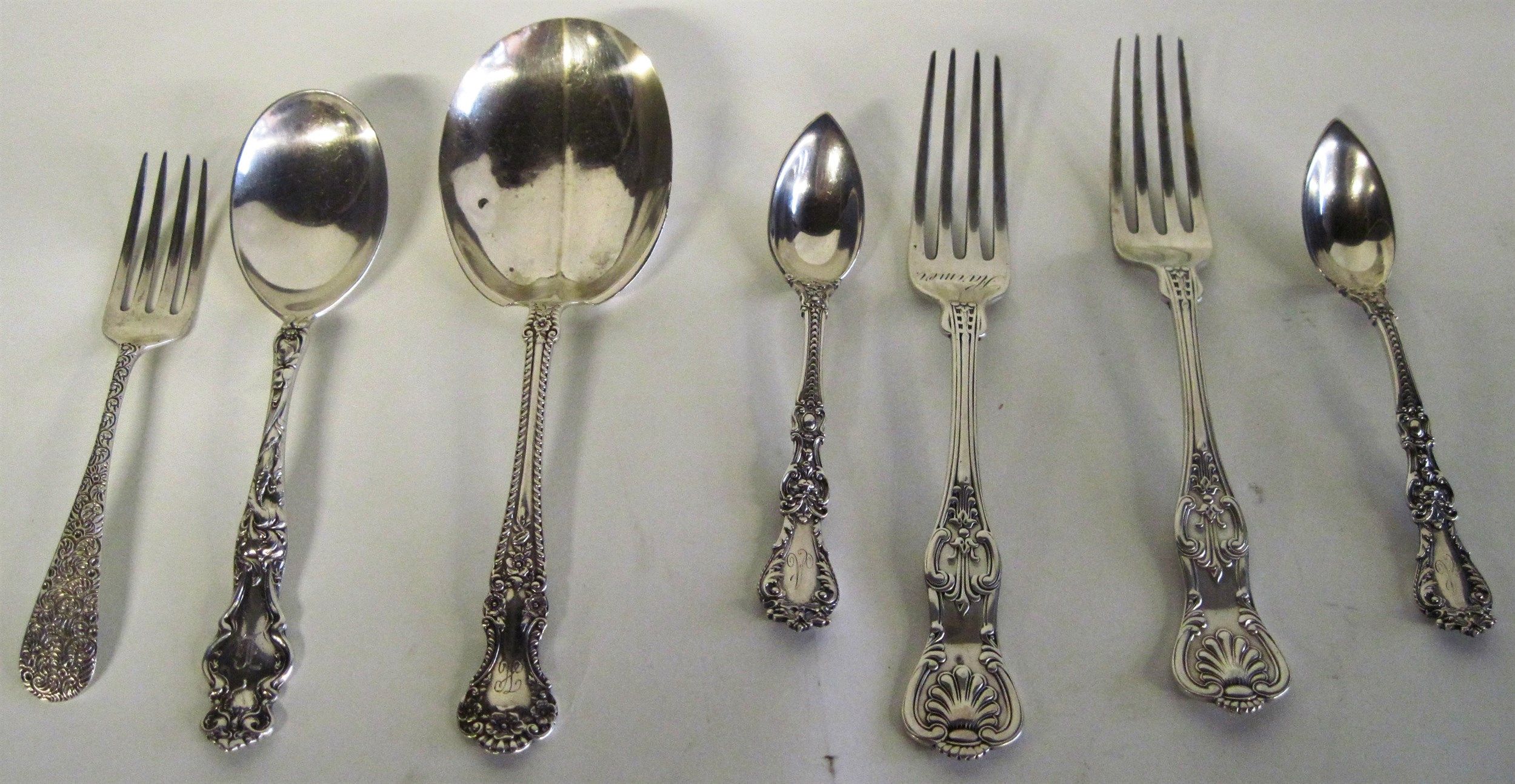Past auction: Collection of thirteen assorted pieces of miscellaneous sterling silver flatware ...